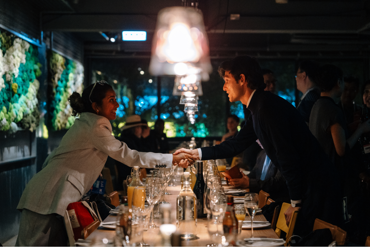 Attendees greet each other at dinner during OFF Taiwan - Oslo Freedom Forum